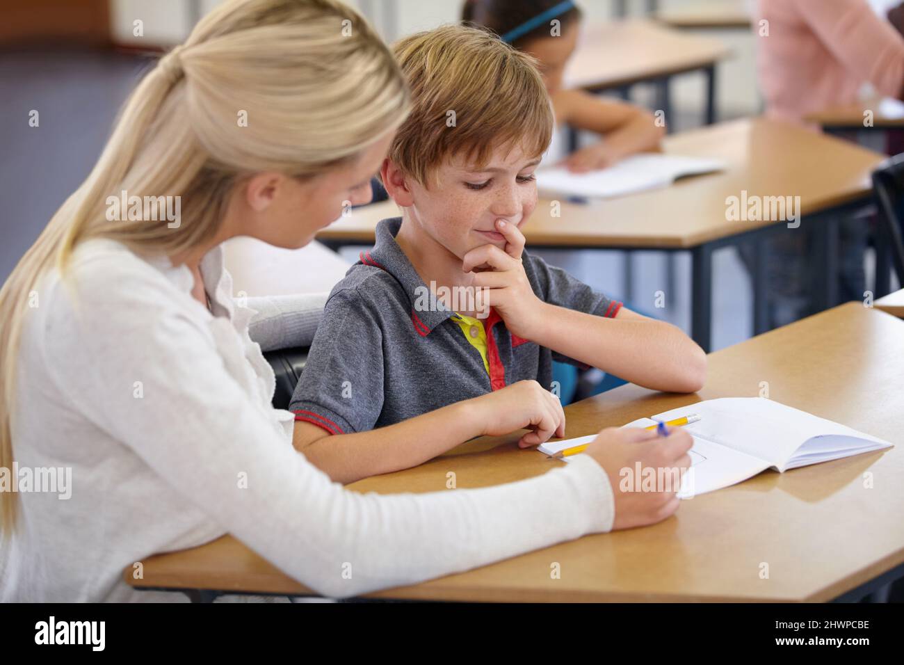 Enriching eager young minds. A young teacher in her classroom Stock ...