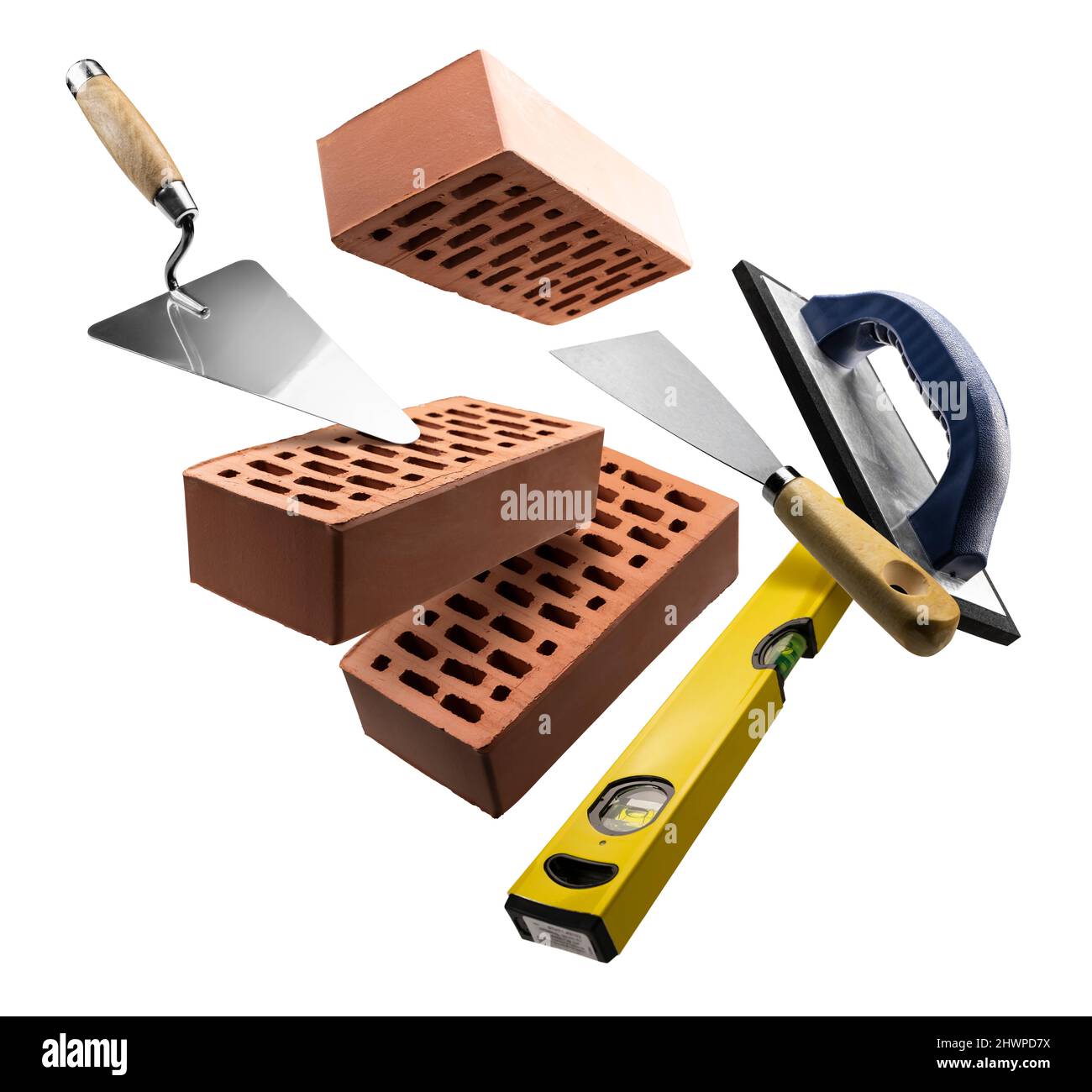 Bricks and construction tools levitate on a white background Stock ...