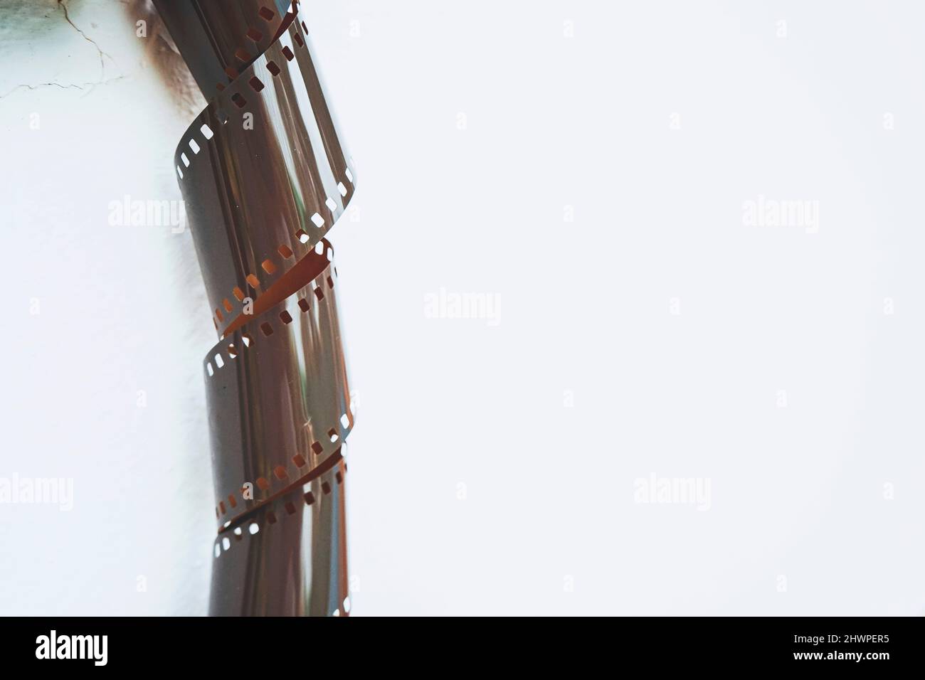 Minimal image of a old film roll against white background Stock Photo ...