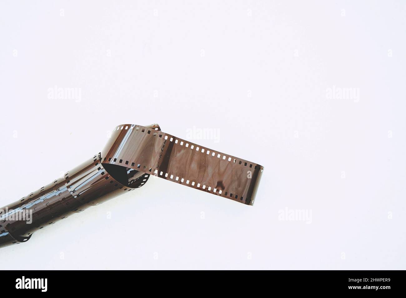 Minimal image of a old film roll against white background Stock Photo ...