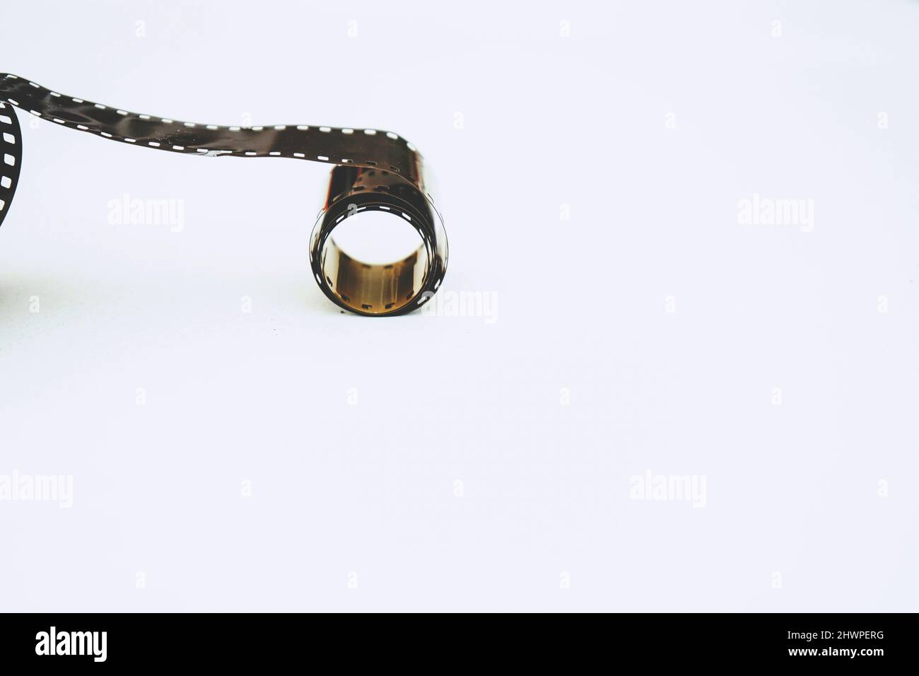 Minimal image of a old film roll against white background Stock Photo ...