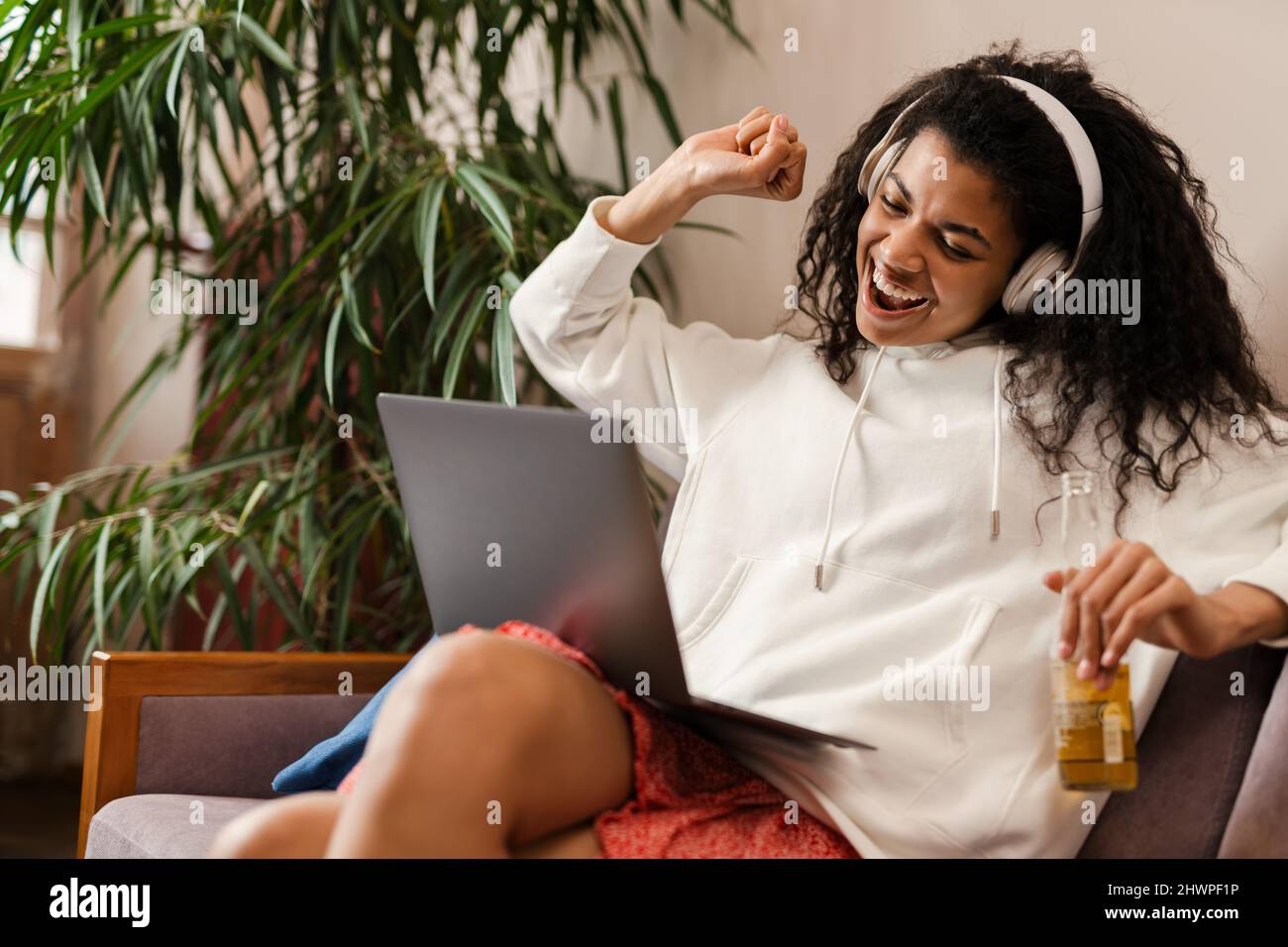 African woman laptop celebrating hi-res stock photography and images ...