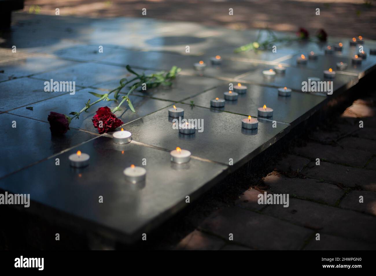 Candles on gravestone wax hi-res stock photography and images - Alamy