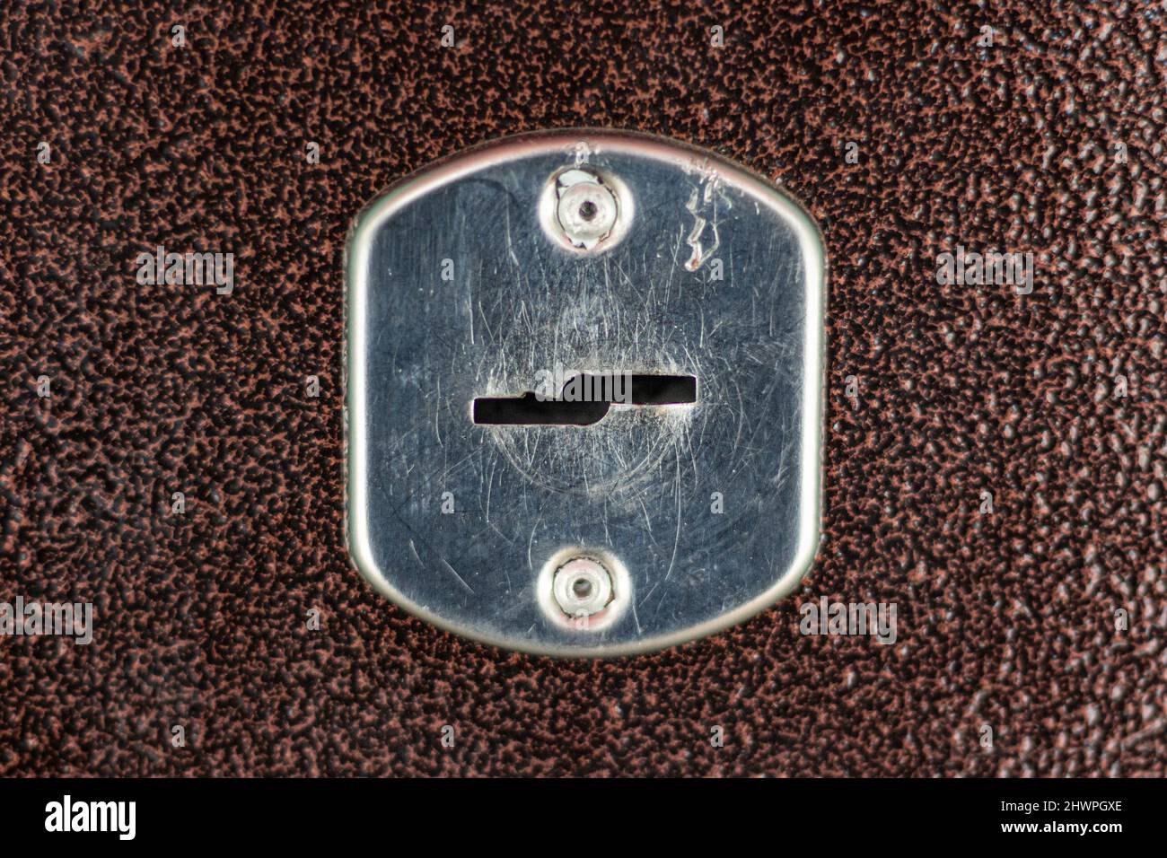 Keyhole for door key. They pulled out steel door. Place to insert key ...