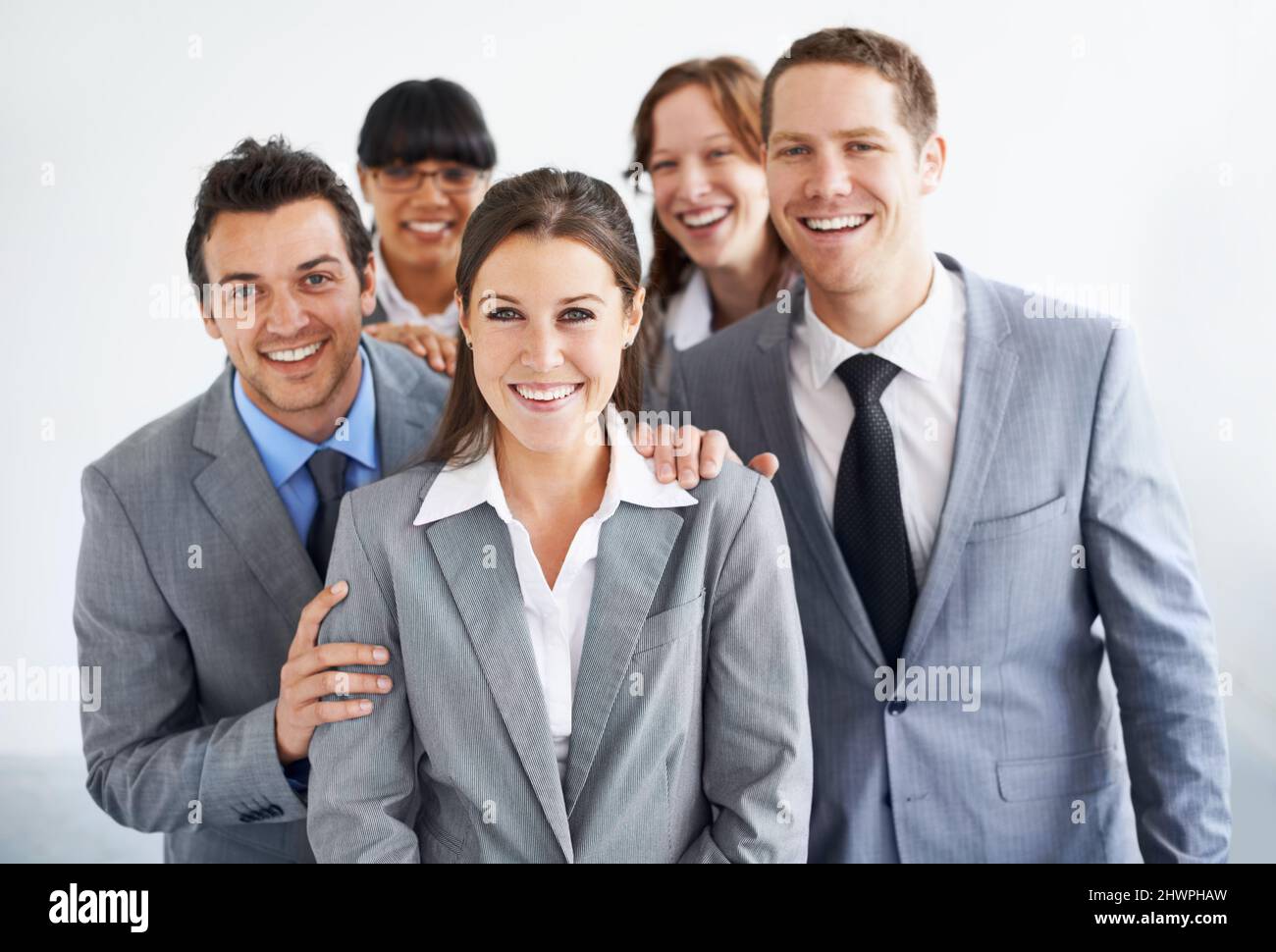 Shes an invaluable asset to the team. A group of businesspeople ...
