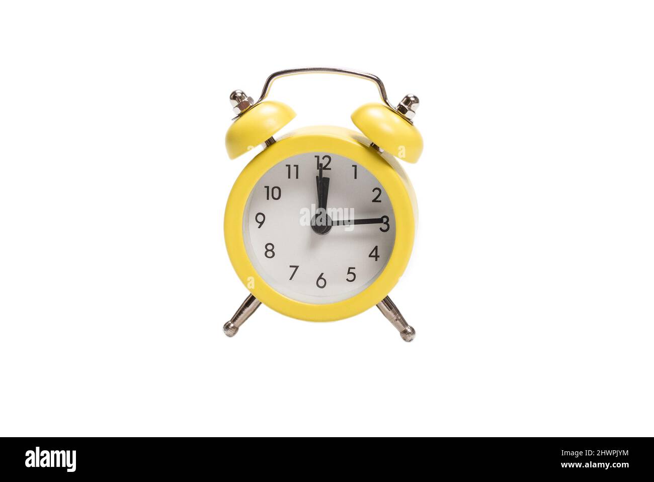 Yellow alarm clock isolated on a white background Stock Photo - Alamy