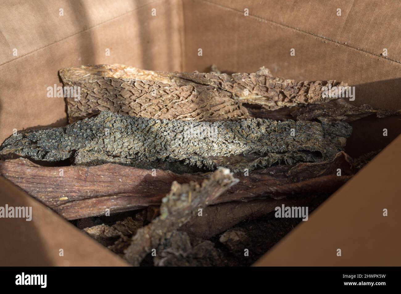 Dried beef offal. Dried tripe. A full cardboard box of chewy dog treats ...