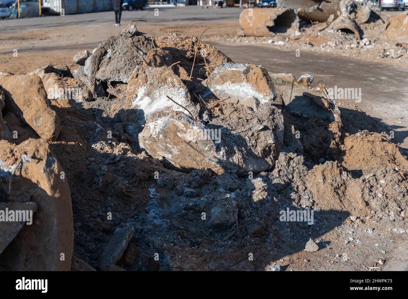 A crumbled concrete structure. A pile of pieces of iron-concrete, rebar ...