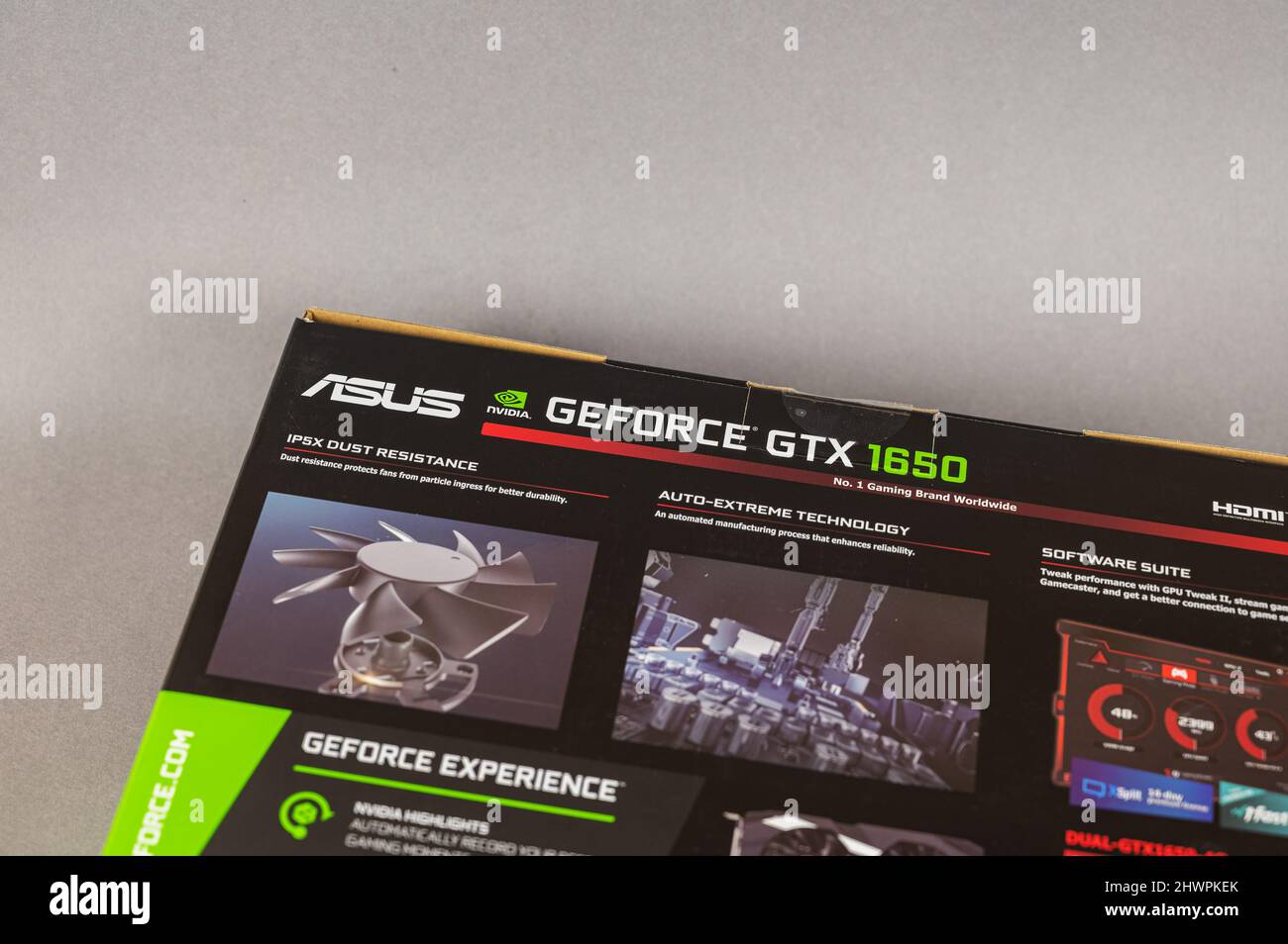 ASUS GFORCE GTX 1650 graphics card against a gray background. Modern ...