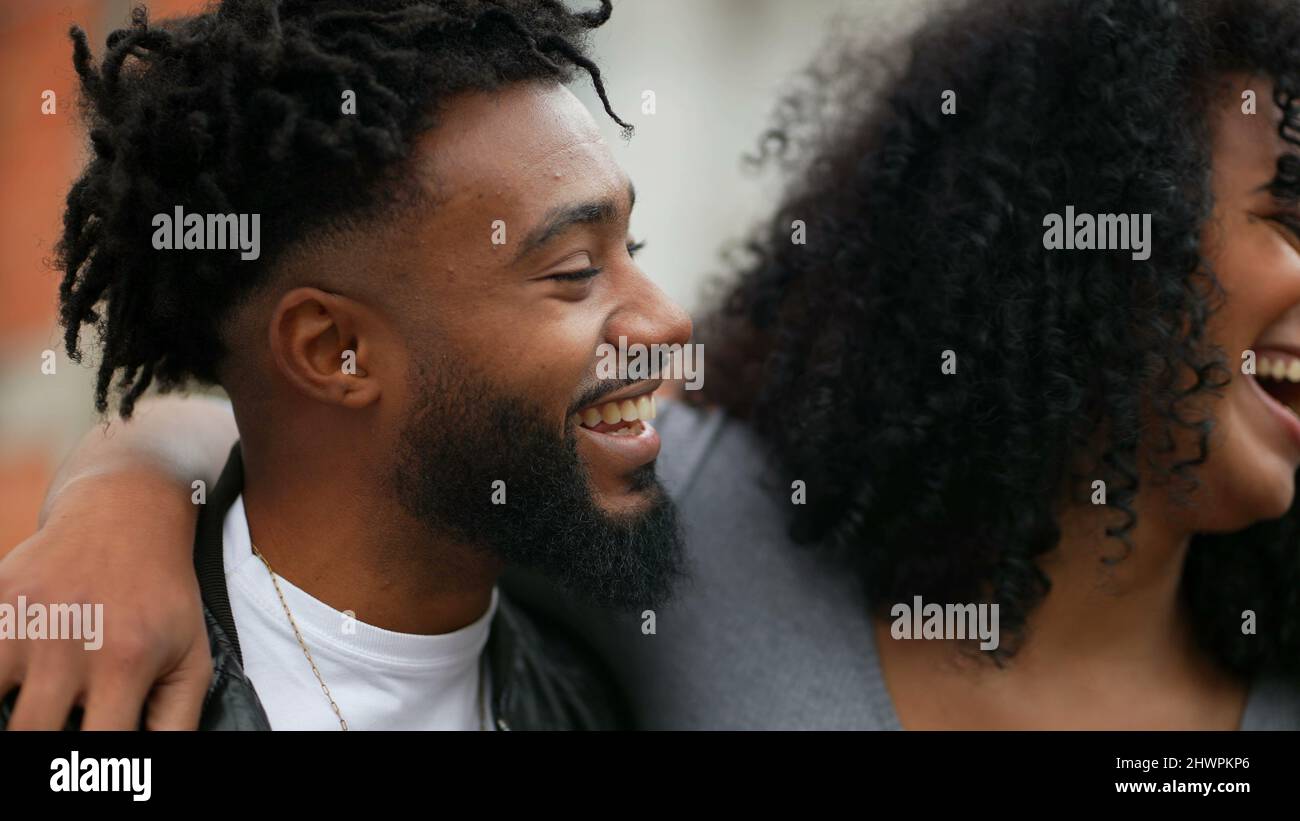 A black couple embrace an african man and woman hug posing Stock Photo ...
