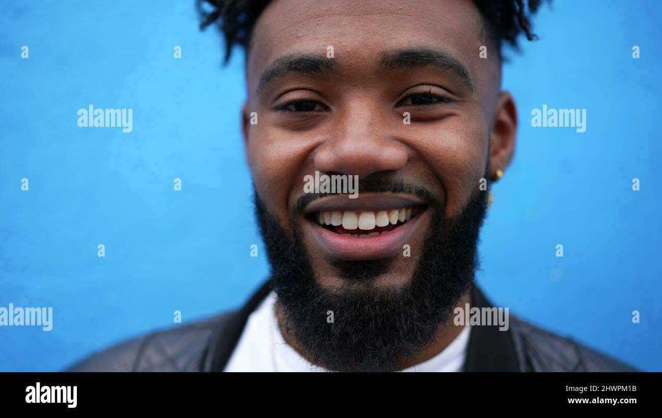 A happy black African man smiling portrait face looking at camera Stock ...