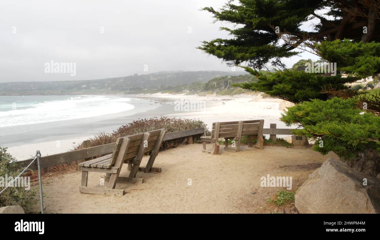 Empty wooden bench, rest on trail path, walkway or footpath. Carmel ...