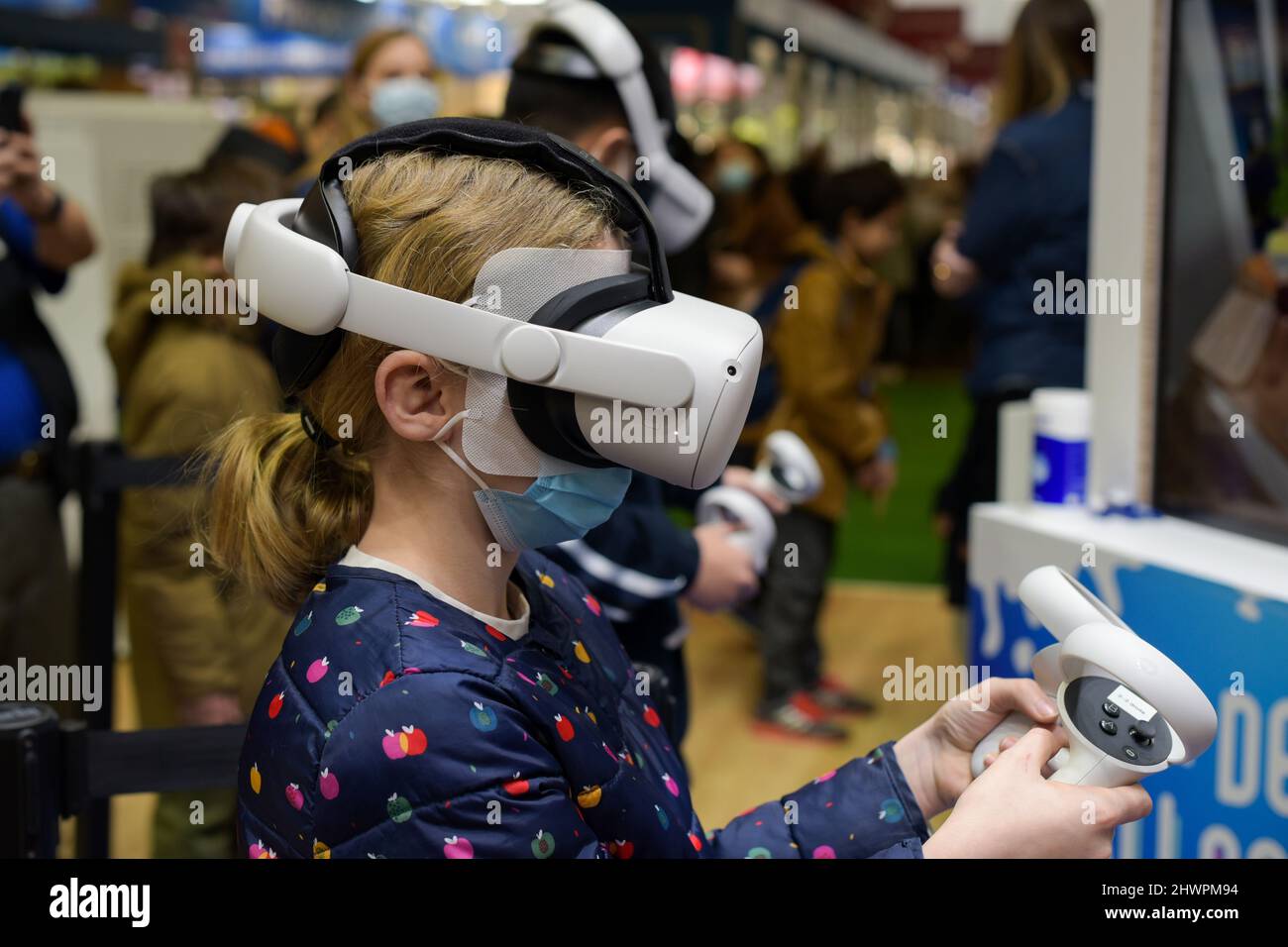 young girl playing an immersion game at an event Stock Photo - Alamy