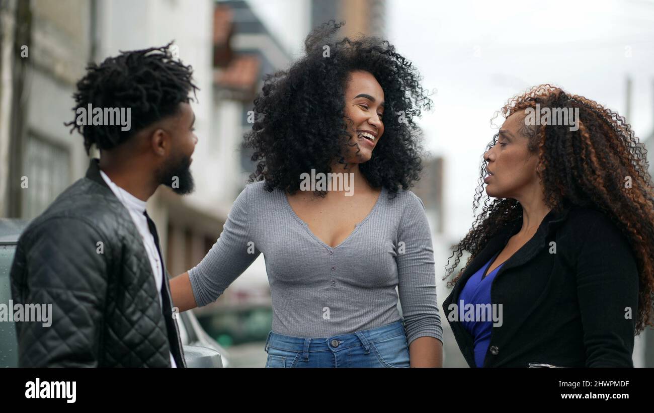 Three Brazilians hanging out talking laughing and smiling Stock Photo ...