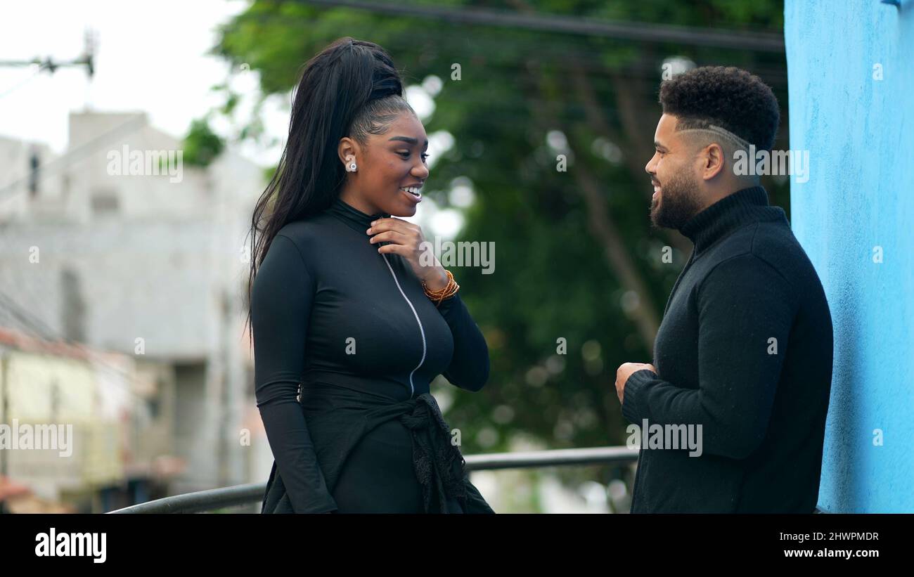 Two friends chatting outside man and woman friendship Stock Photo - Alamy