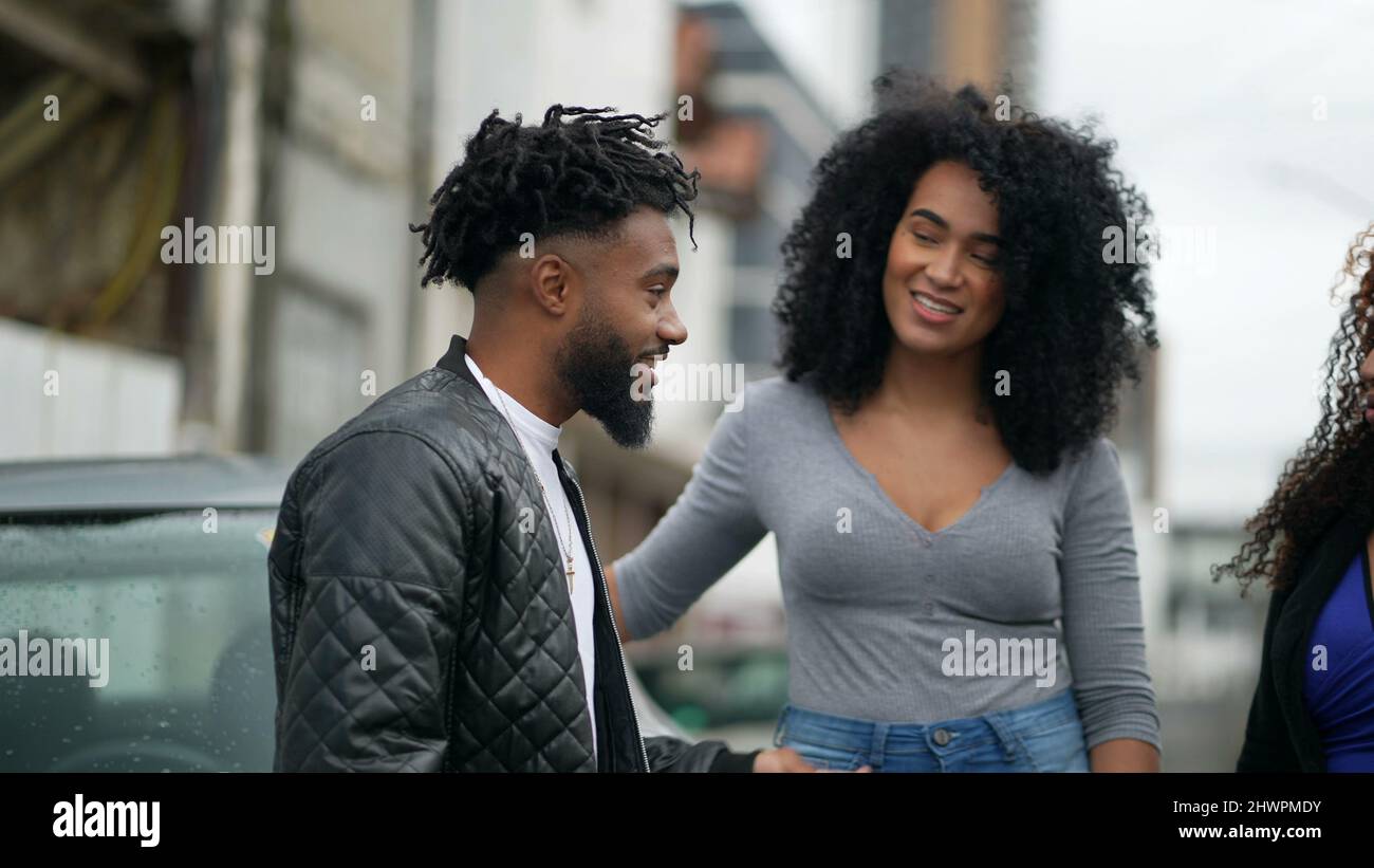 Three Brazilians hanging out talking laughing and smiling Stock Photo ...