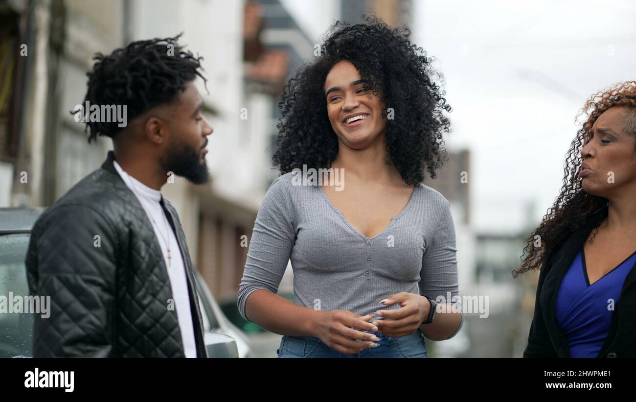 Three Brazilians hanging out talking laughing and smiling Stock Photo ...