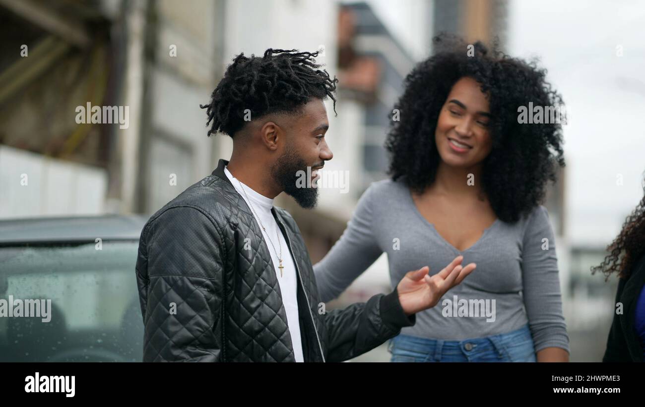Three Brazilians hanging out talking laughing and smiling Stock Photo ...