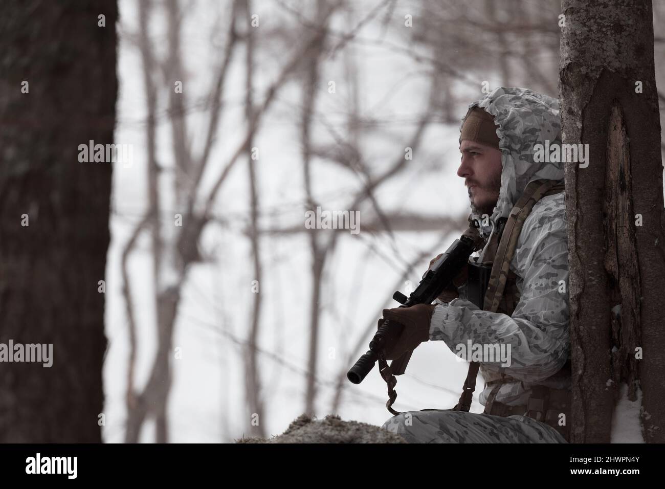 Soldier in winter camouflaged uniform in Modern warfare army on a snow ...