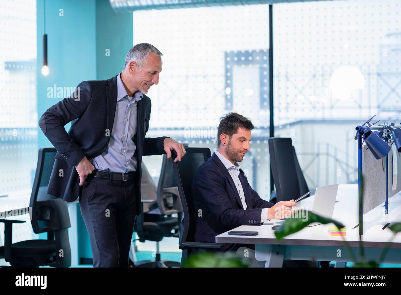 Businessman leaning over office chair hi-res stock photography and ...