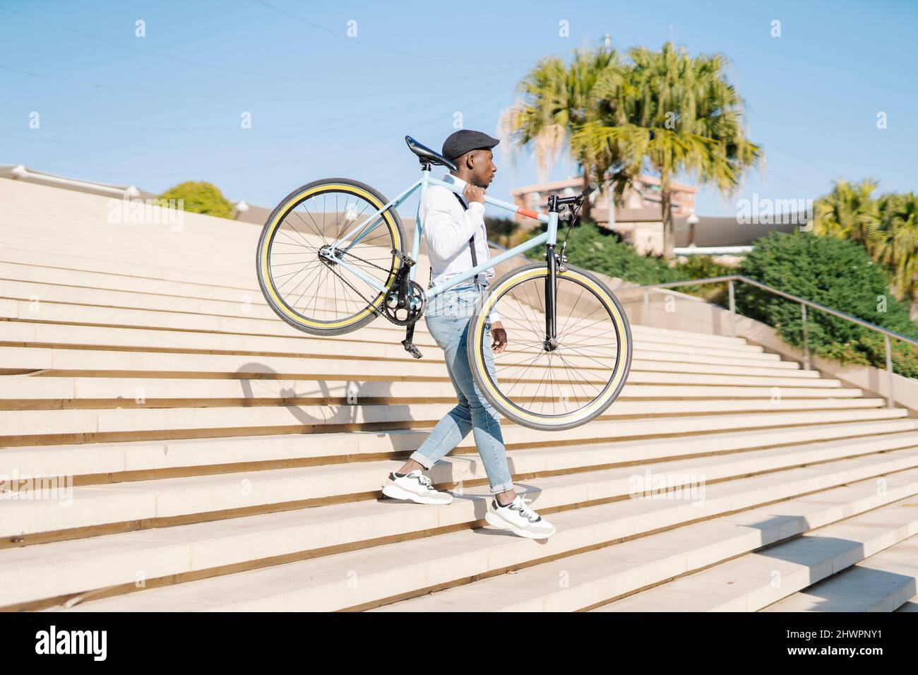 Man moving down on staircase hi-res stock photography and images - Alamy