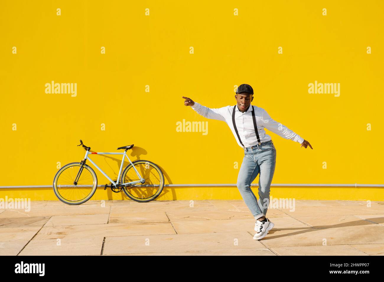 Young man in light yellow hi-res stock photography and images - Alamy
