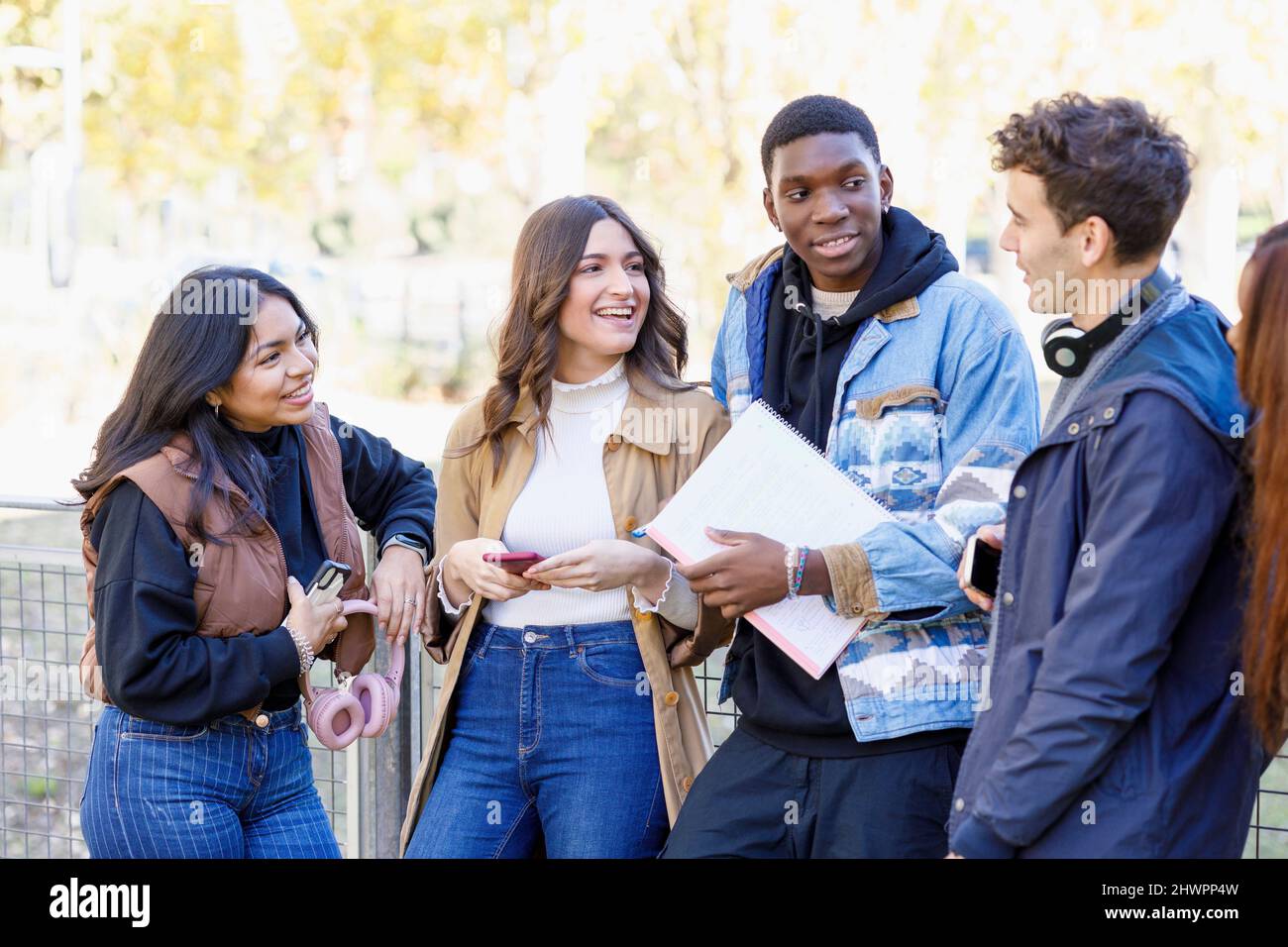 University students discussing on campus Stock Photo - Alamy