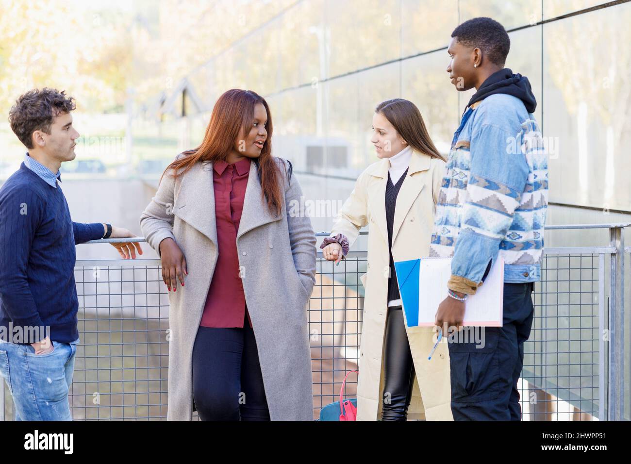 University students discussing at campus Stock Photo - Alamy
