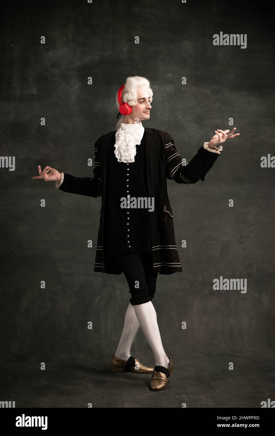 Portrait of young man wearing wig and vintage medieval outfit like ...