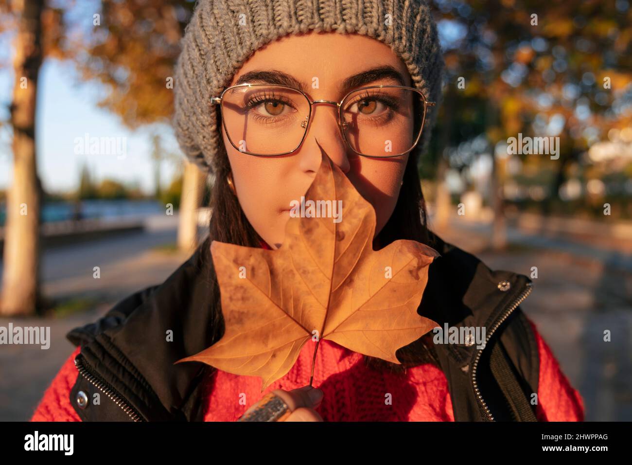 Young woman covering with clothes hi-res stock photography and images ...