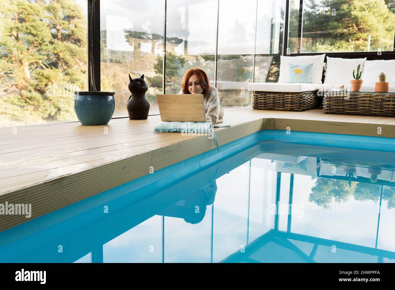 Using computer in swimming pool hi-res stock photography and images - Alamy