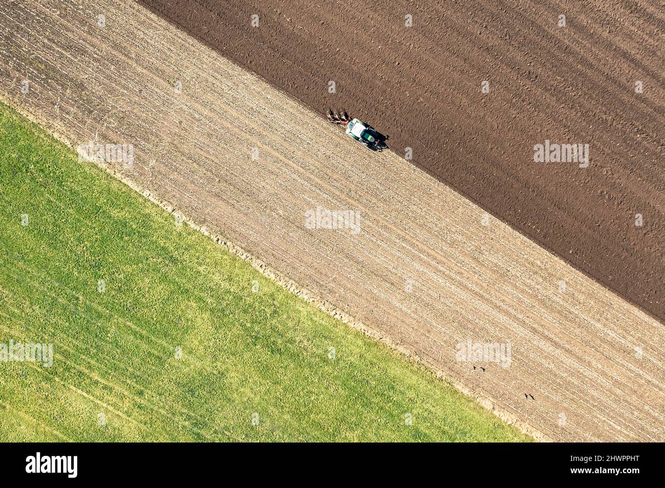 Side view of tractor with plough hi-res stock photography and images ...