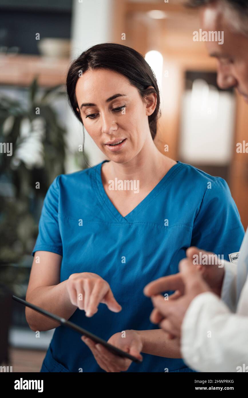 Doctor nurse looking documents hi-res stock photography and images - Alamy