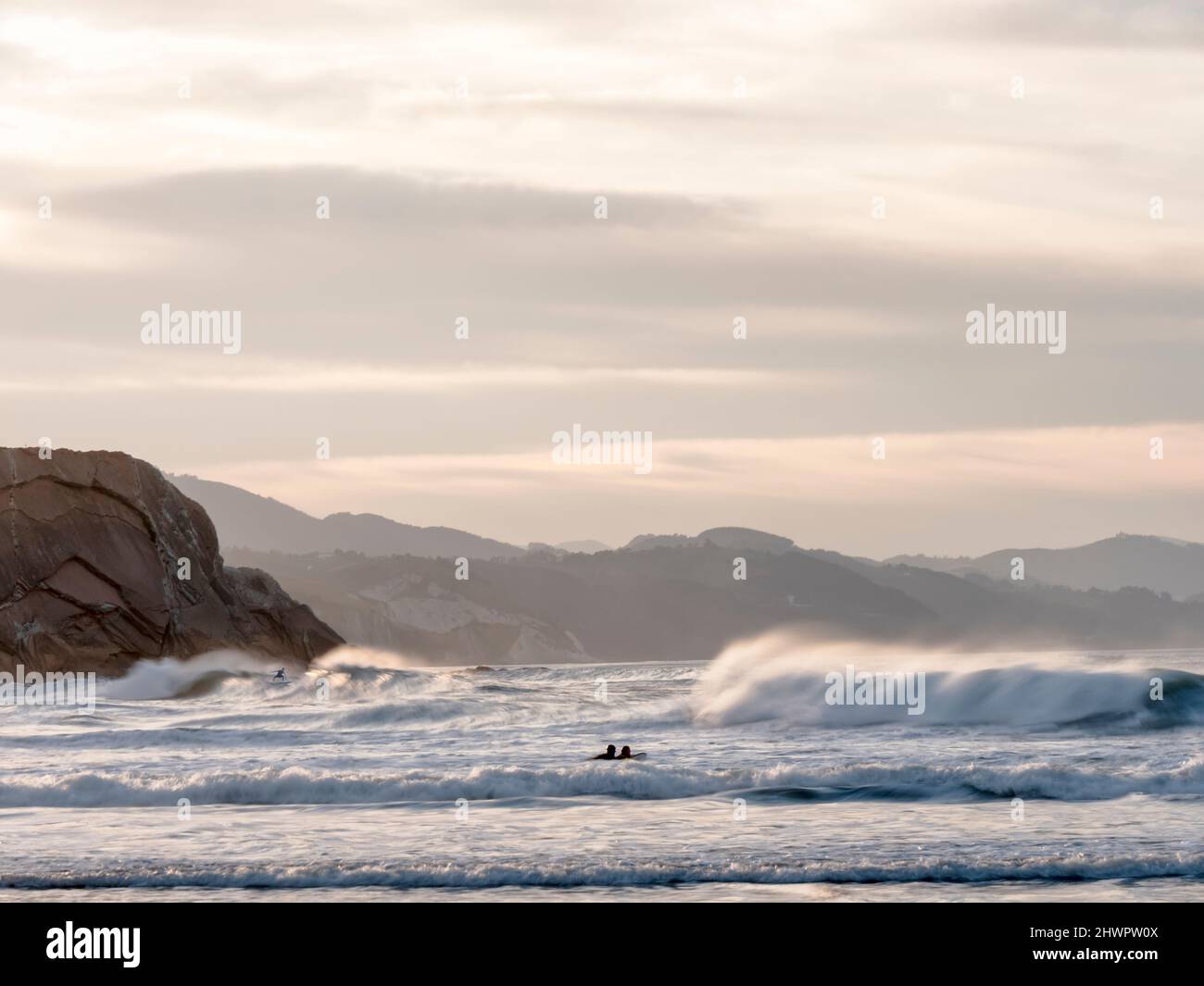 Sea waves rushing towards shore at sunset, Basque Coast Geopark, Basque ...