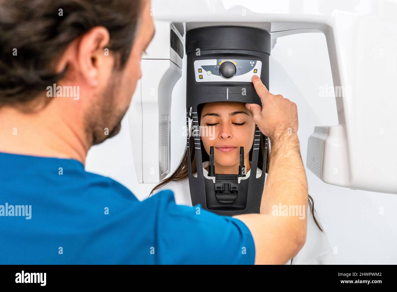 Doctor examining patient through machinery at medical clinic Stock ...