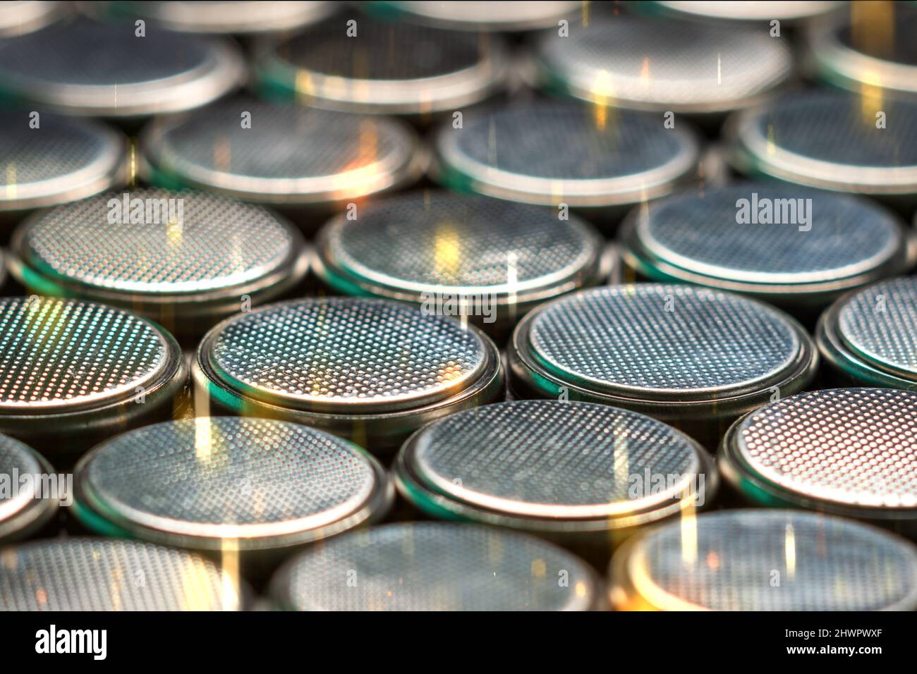 CR2032 coin cell batteries background closeup pan slide Stock Photo - Alamy