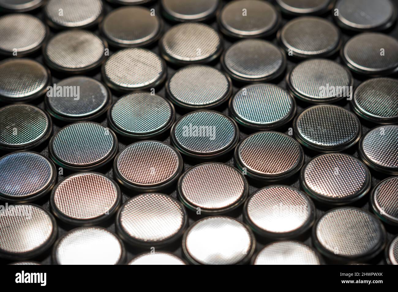 CR2032 coin cell batteries background closeup pan slide Stock Photo - Alamy