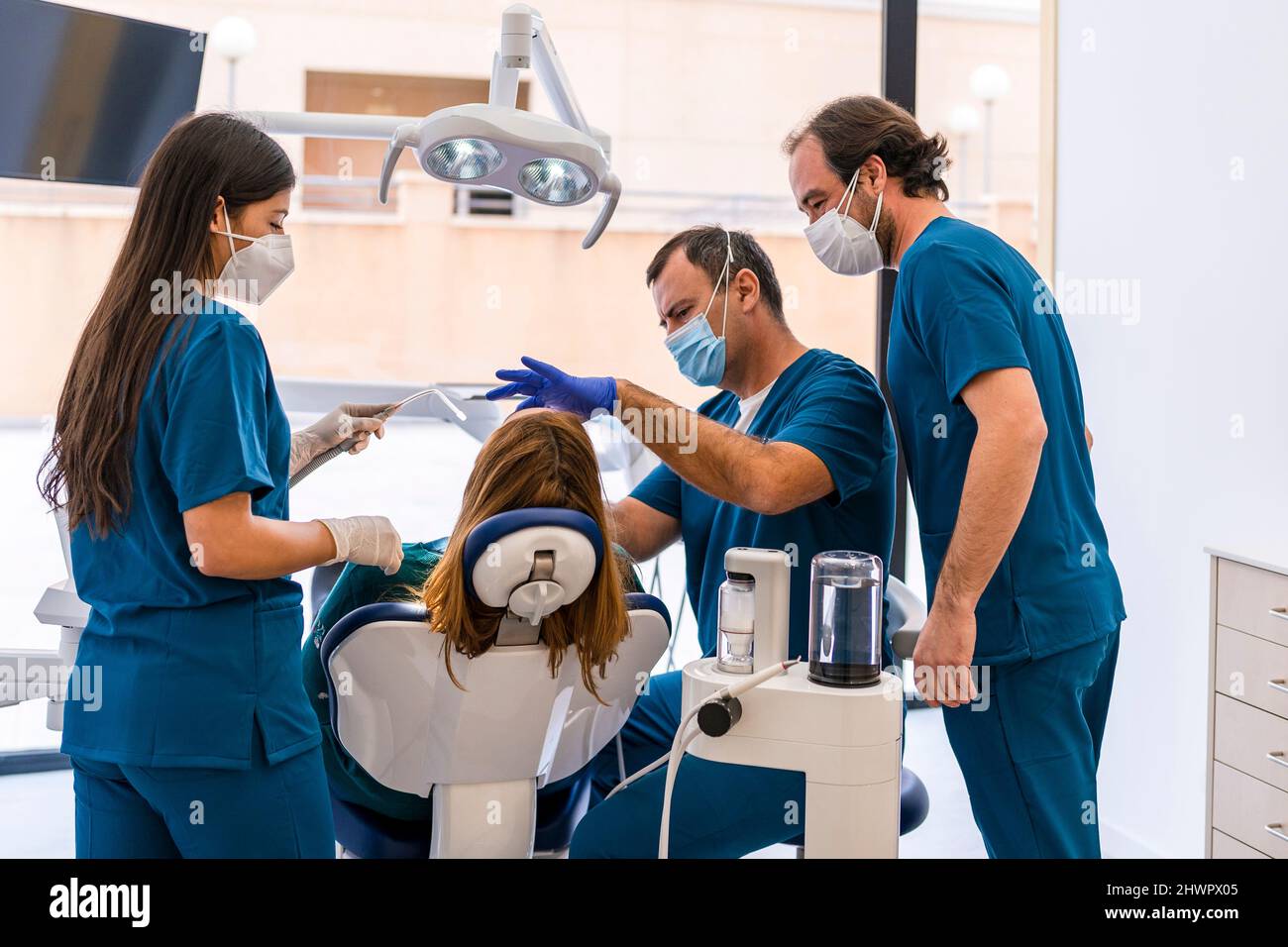 Doctors and nurse treating patient in hospital during pandemic Stock ...