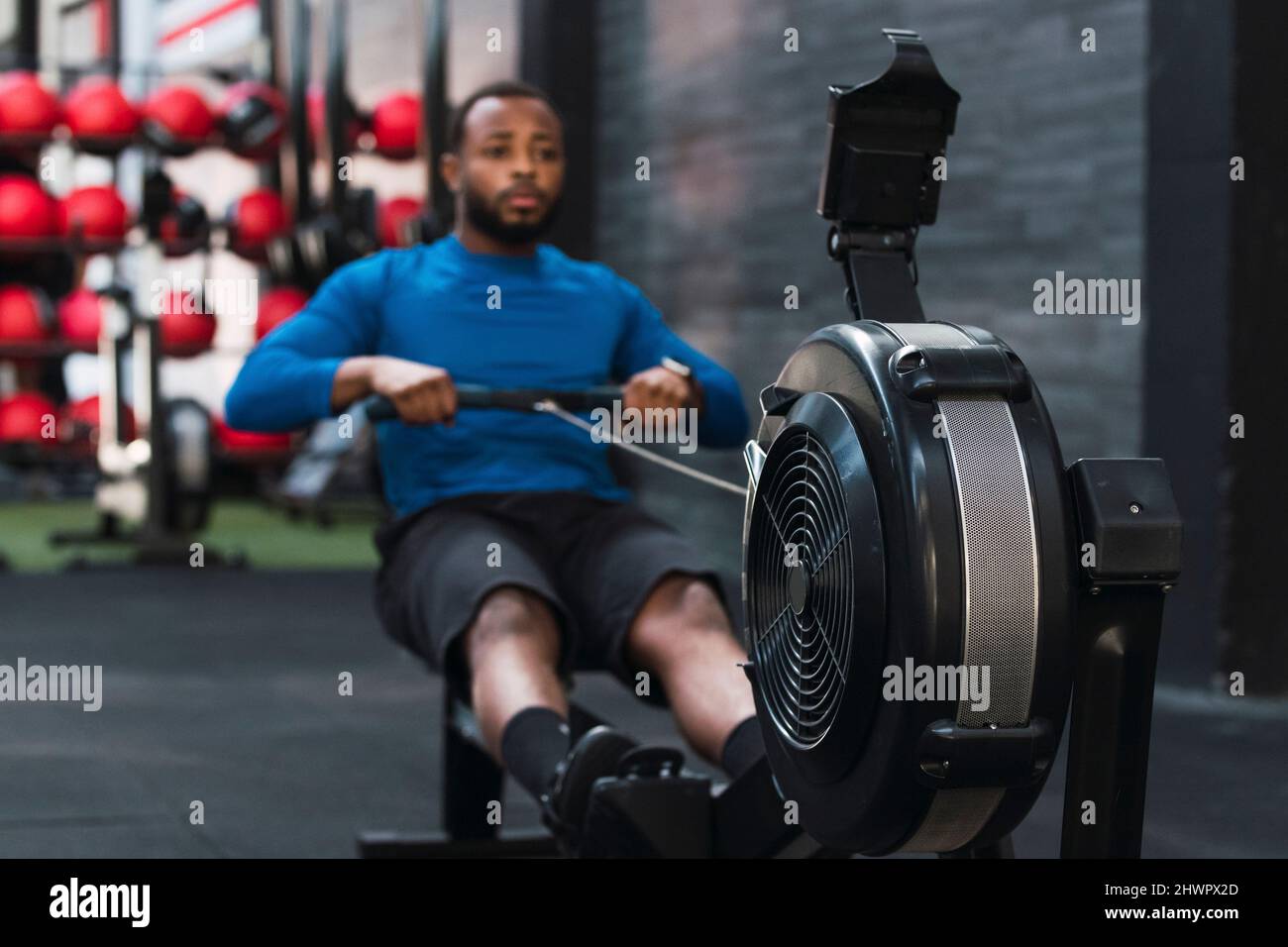 Man on rowing machine hi-res stock photography and images - Alamy