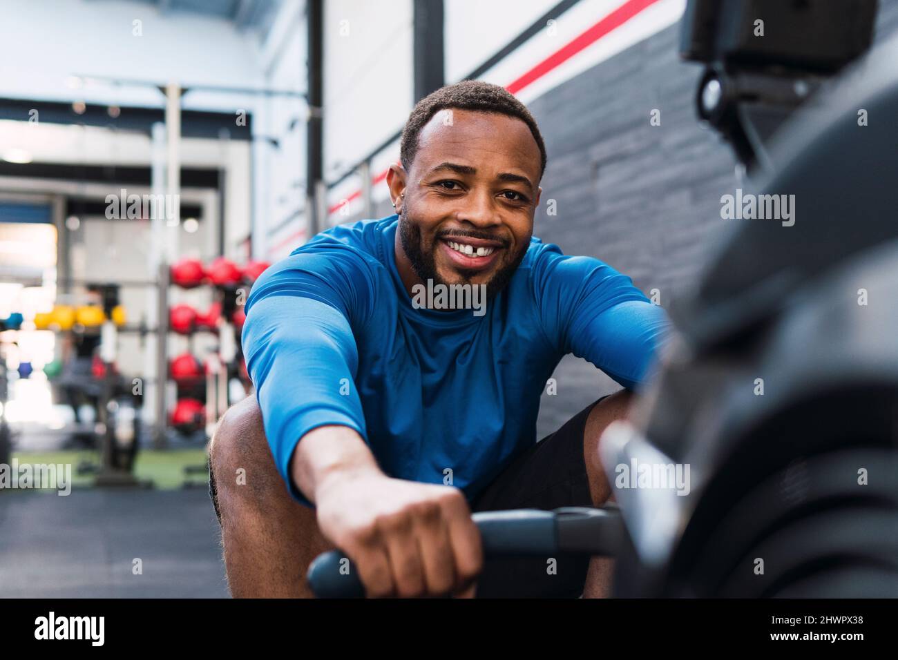 Athlete with gap teeth exercising in gym Stock Photo - Alamy