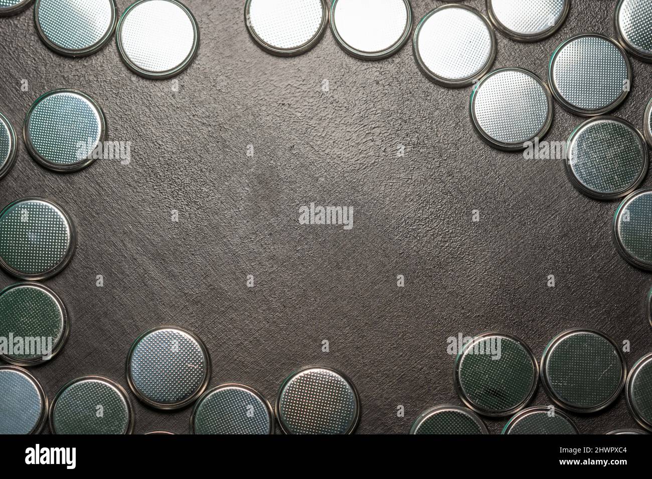 CR2032 coin cell batteries background closeup pan slide Stock Photo - Alamy