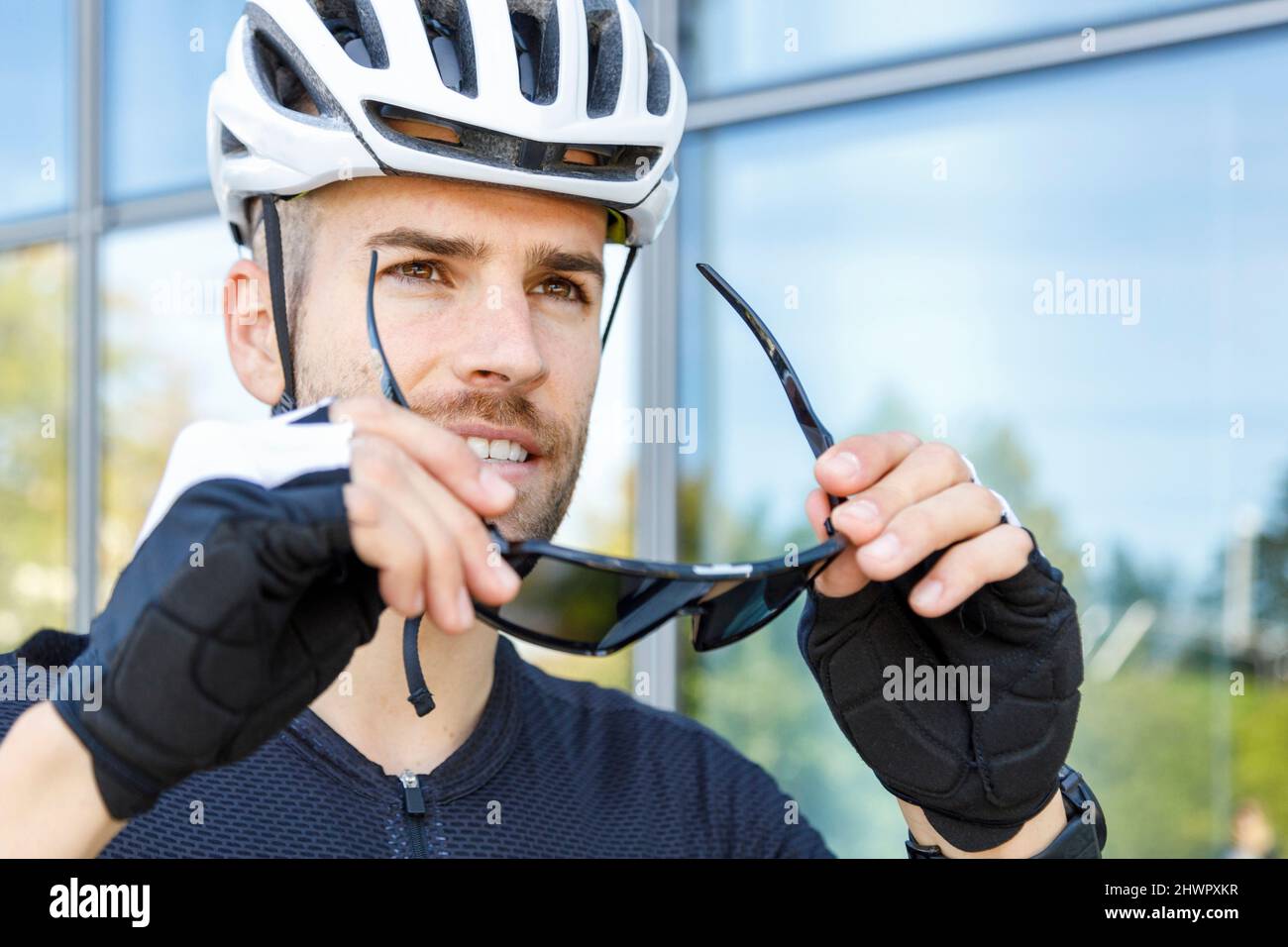 Man wearing cycling helmet sunglasses hi-res stock photography and images - Alamy