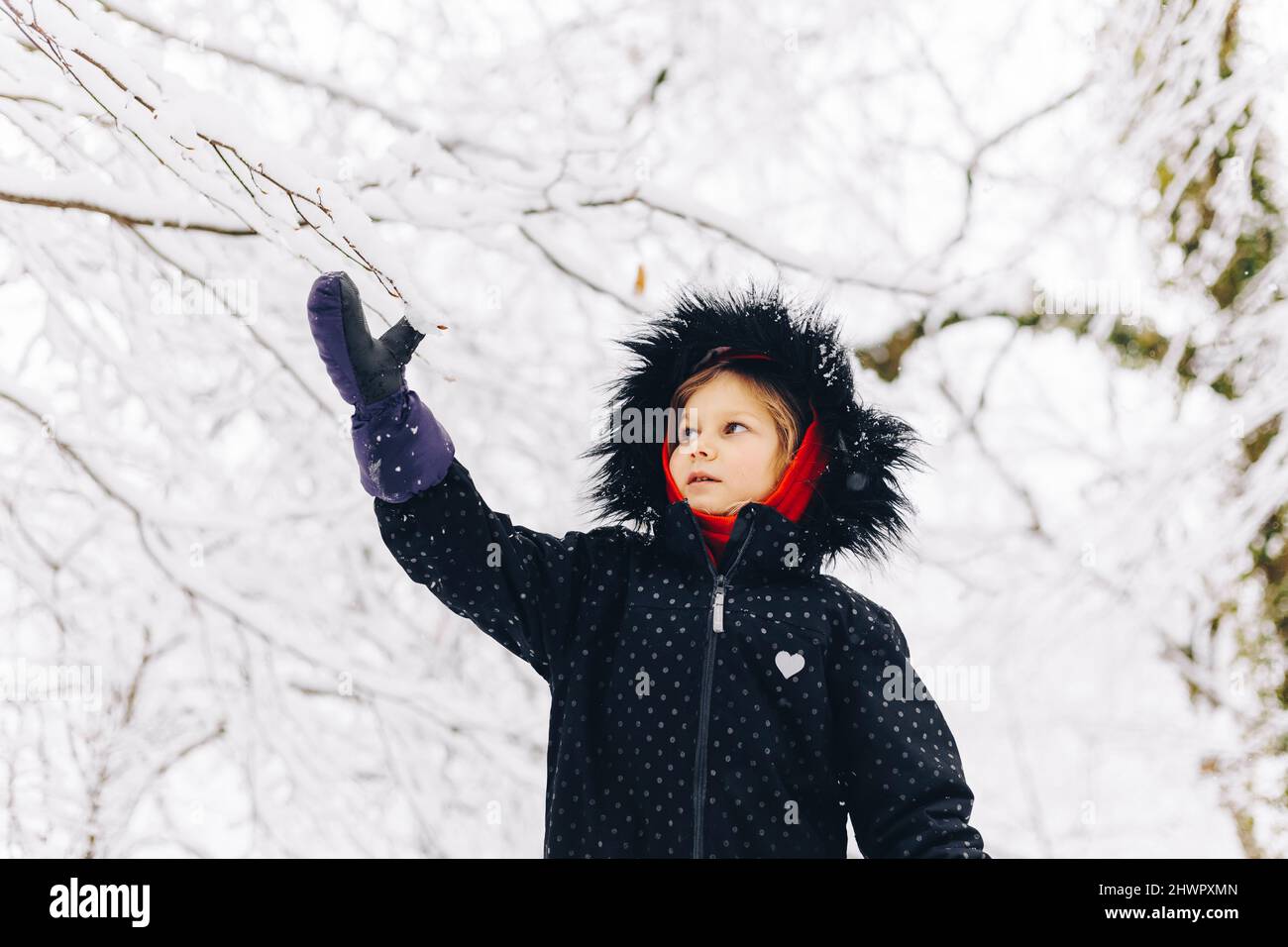 Child touching snow hi-res stock photography and images - Alamy