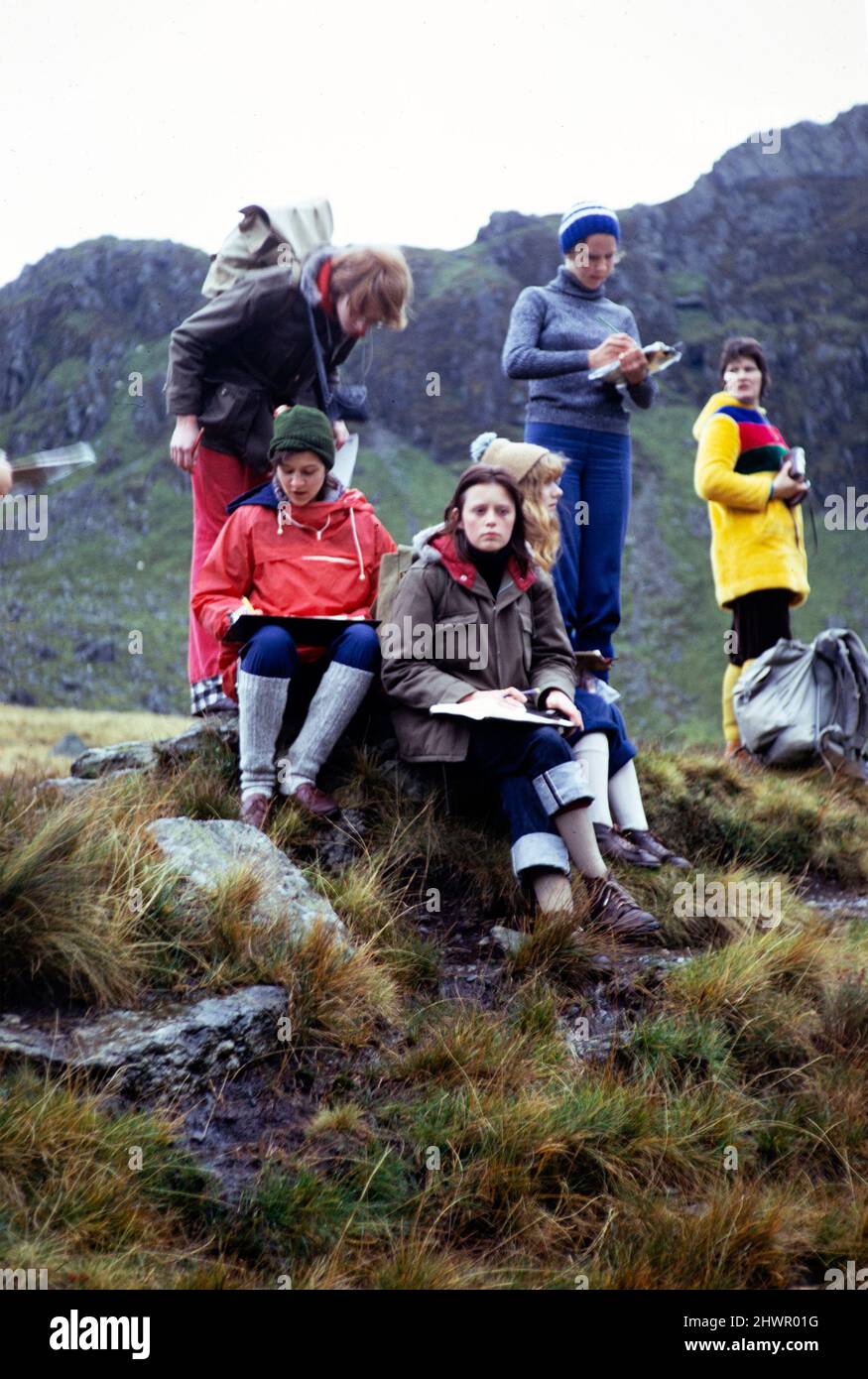 Female secondary school students engaged in geography fieldwork, UK ...