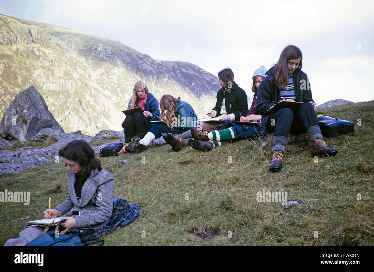 Female secondary school students engaged in geography fieldwork, UK ...