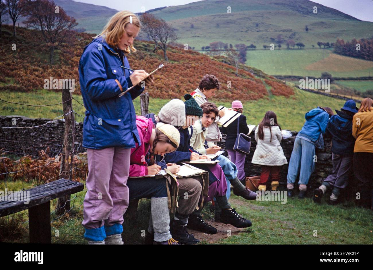 Female secondary school students engaged in geography fieldwork, UK ...
