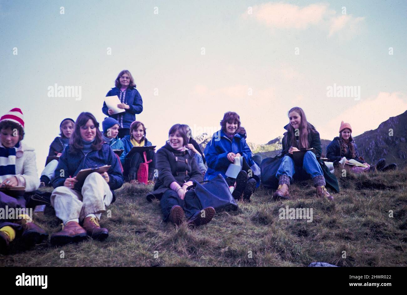Female secondary school students engaged in geography fieldwork, UK ...