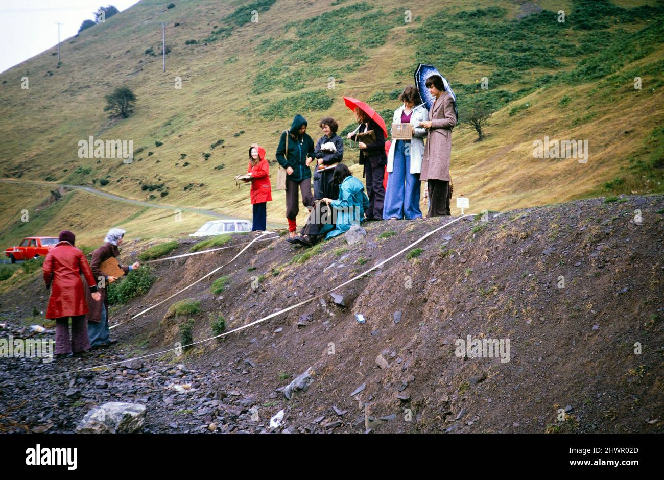 Female secondary school students engaged in geography fieldwork, UK ...