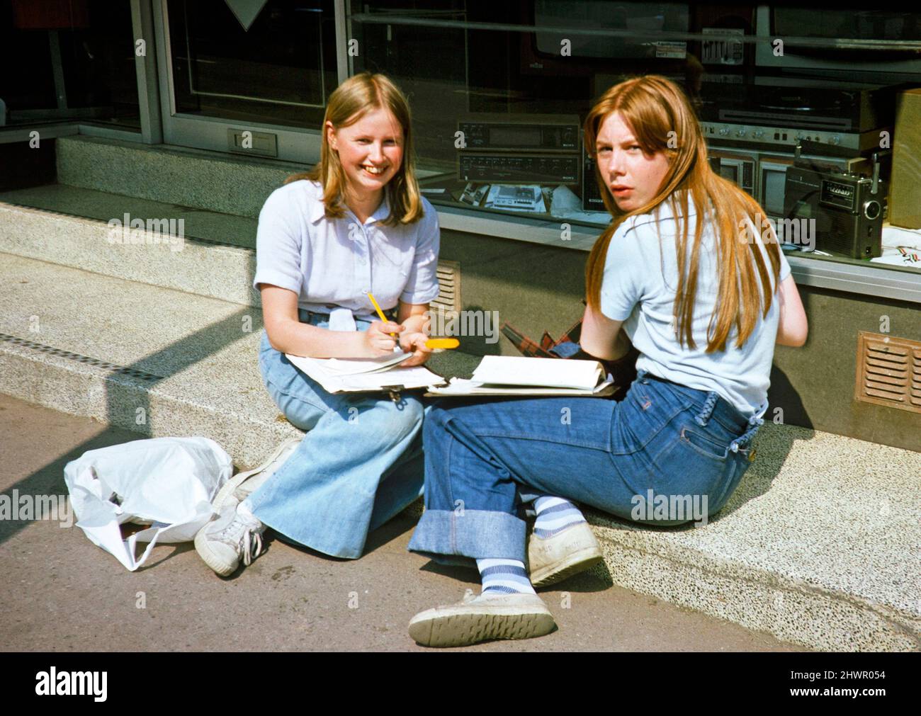 Female secondary school students engaged in geography fieldwork, UK ...
