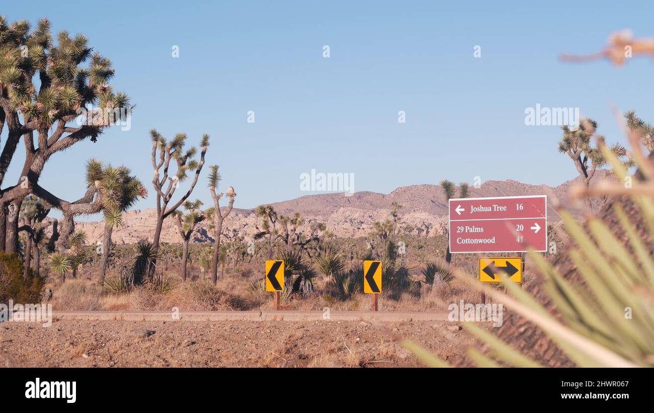 Crossroad sign with direction arrows on road intersection, California ...